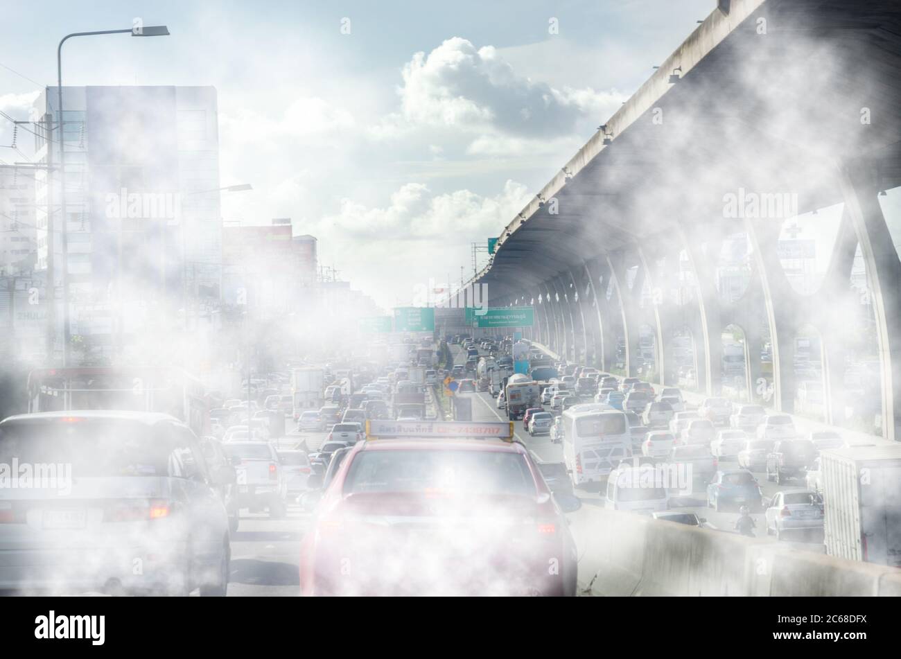 Pollution from vehicle exhaust in the city. Traffic jam on the road ...