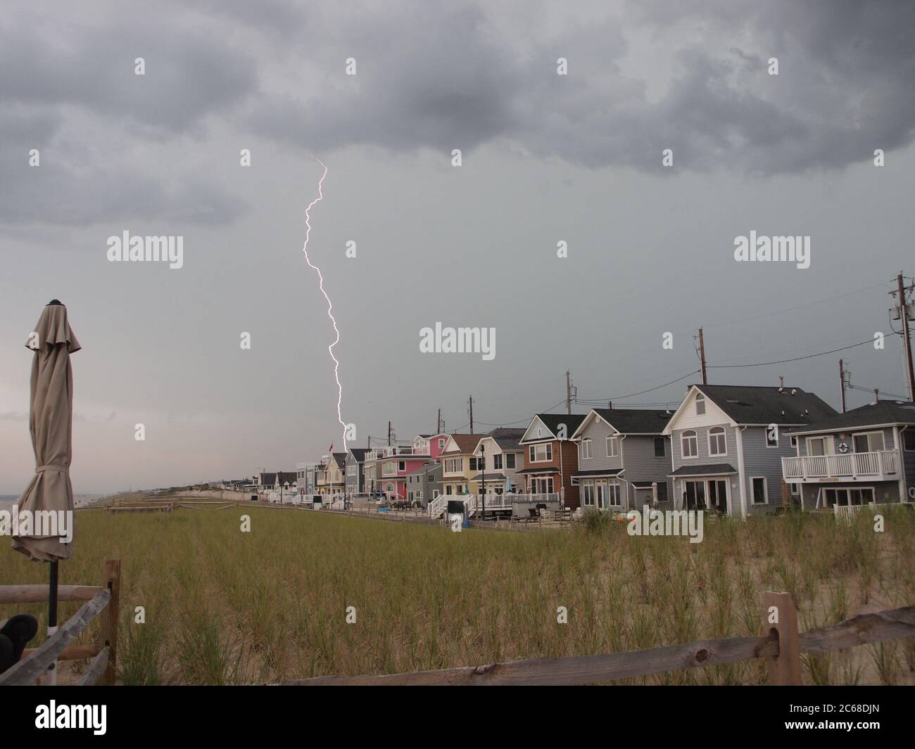 Lightning storm over shore homes hi-res stock photography and images ...