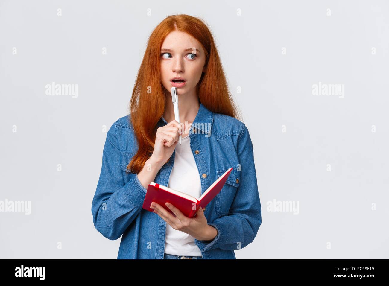 Talented, creative good-looking redhead woman writing poem, story ...