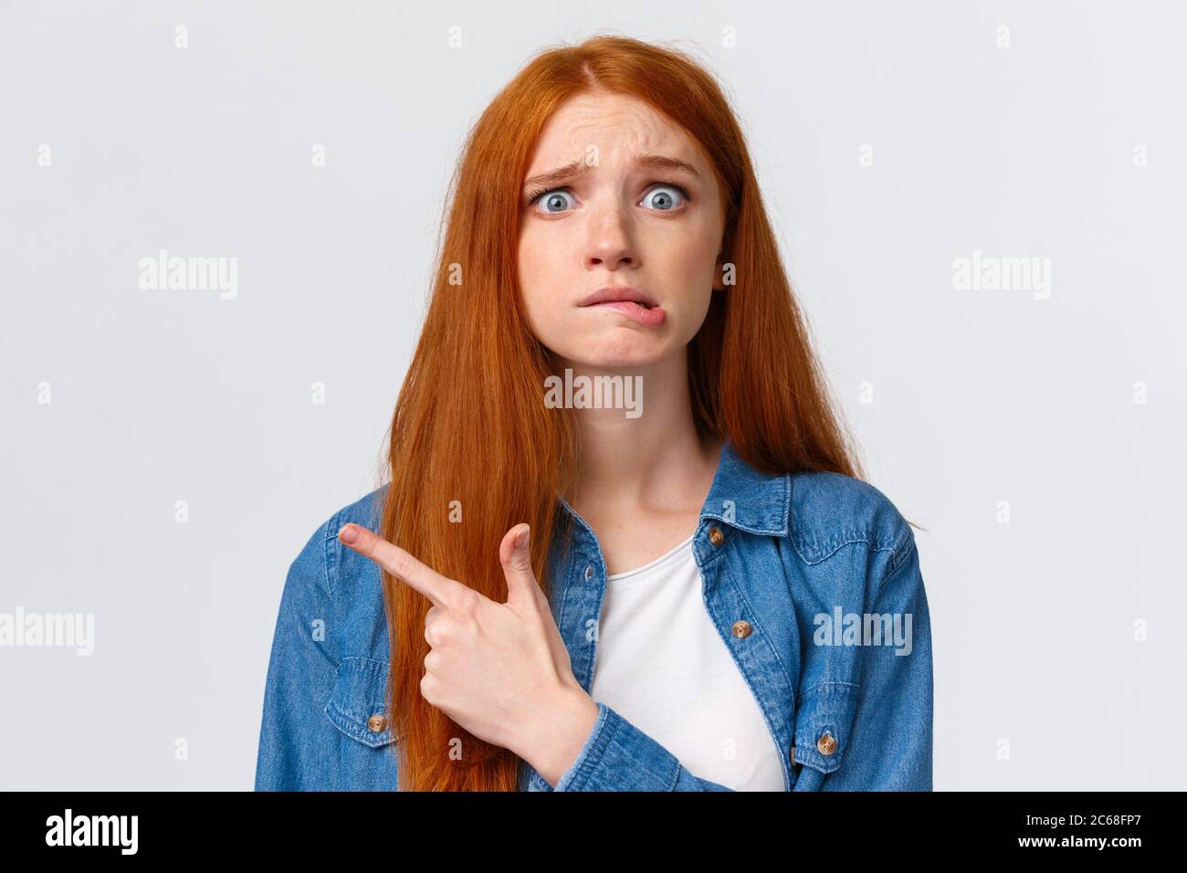 Anxious and worried concerned redhead caucasian girl having big ...