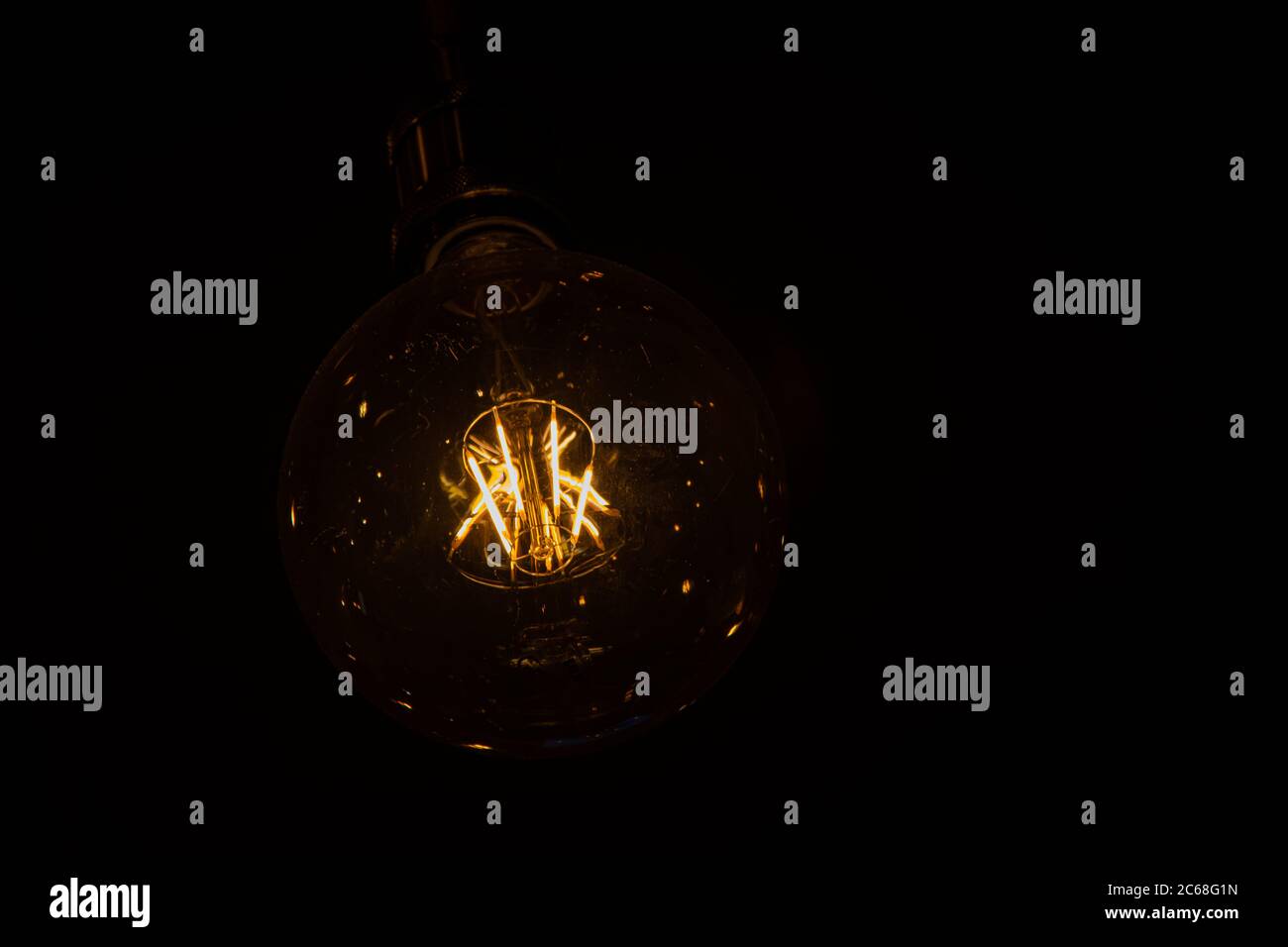 Vintage worm lamp lighting and black background photography Stock Photo ...