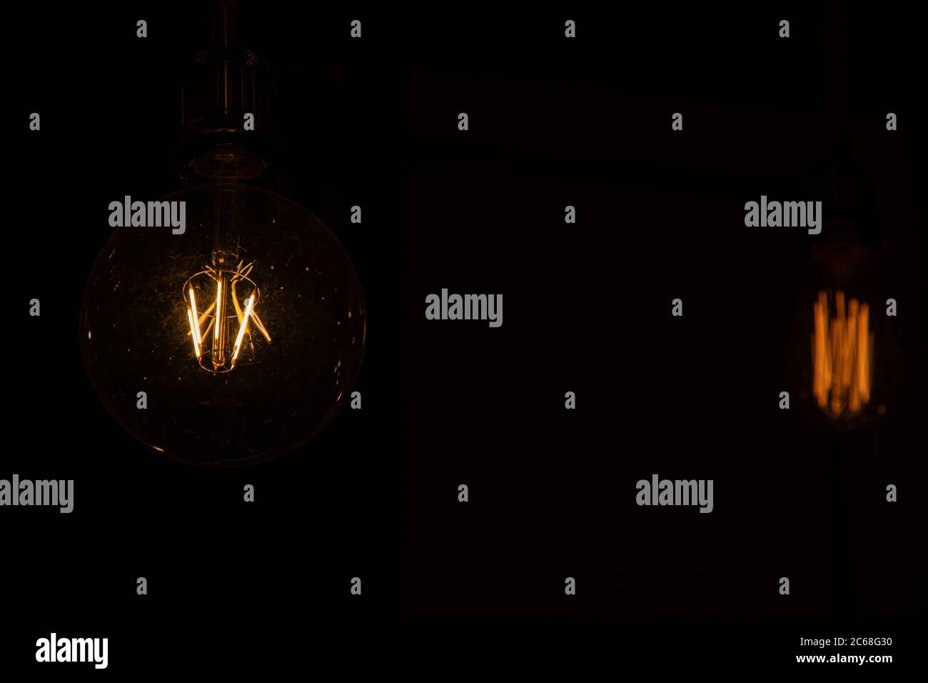 Vintage worm lamp lighting and black background photography Stock Photo ...