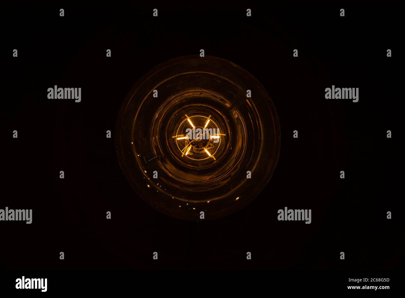 Vintage worm lamp lighting and black background photography Stock Photo ...