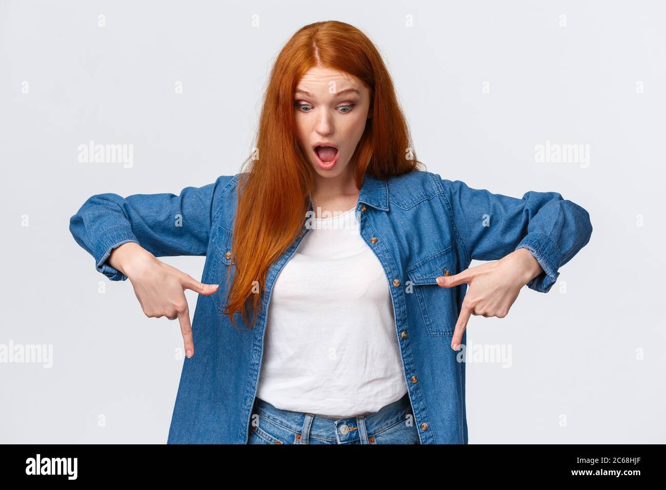 Waist-up portrait impressed, curious and astonished redhead cheerful ...