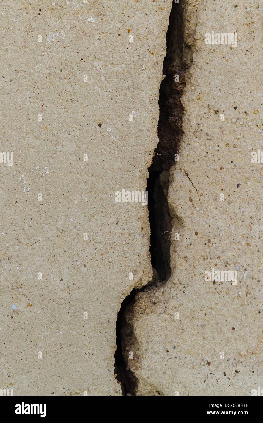Large crack in the wall of the house. Closeup, cracked, damage. Close ...