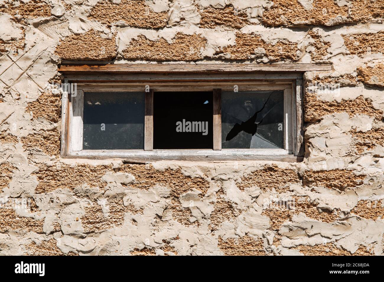 Broken glass in a building window. Housing problems Stock Photo - Alamy