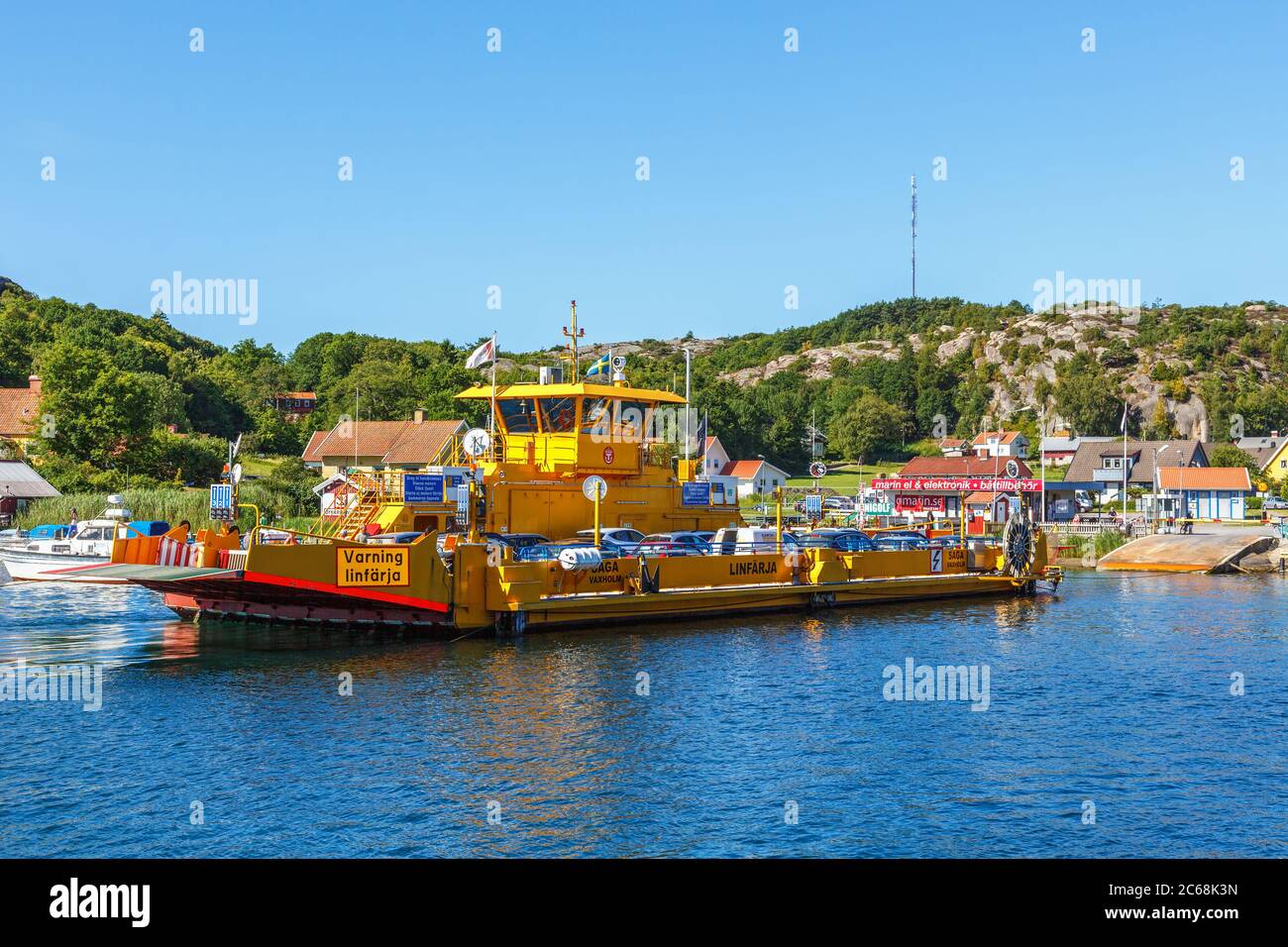 Car ferry on the way to harbour in Hamburgsund on the swedish coast ...