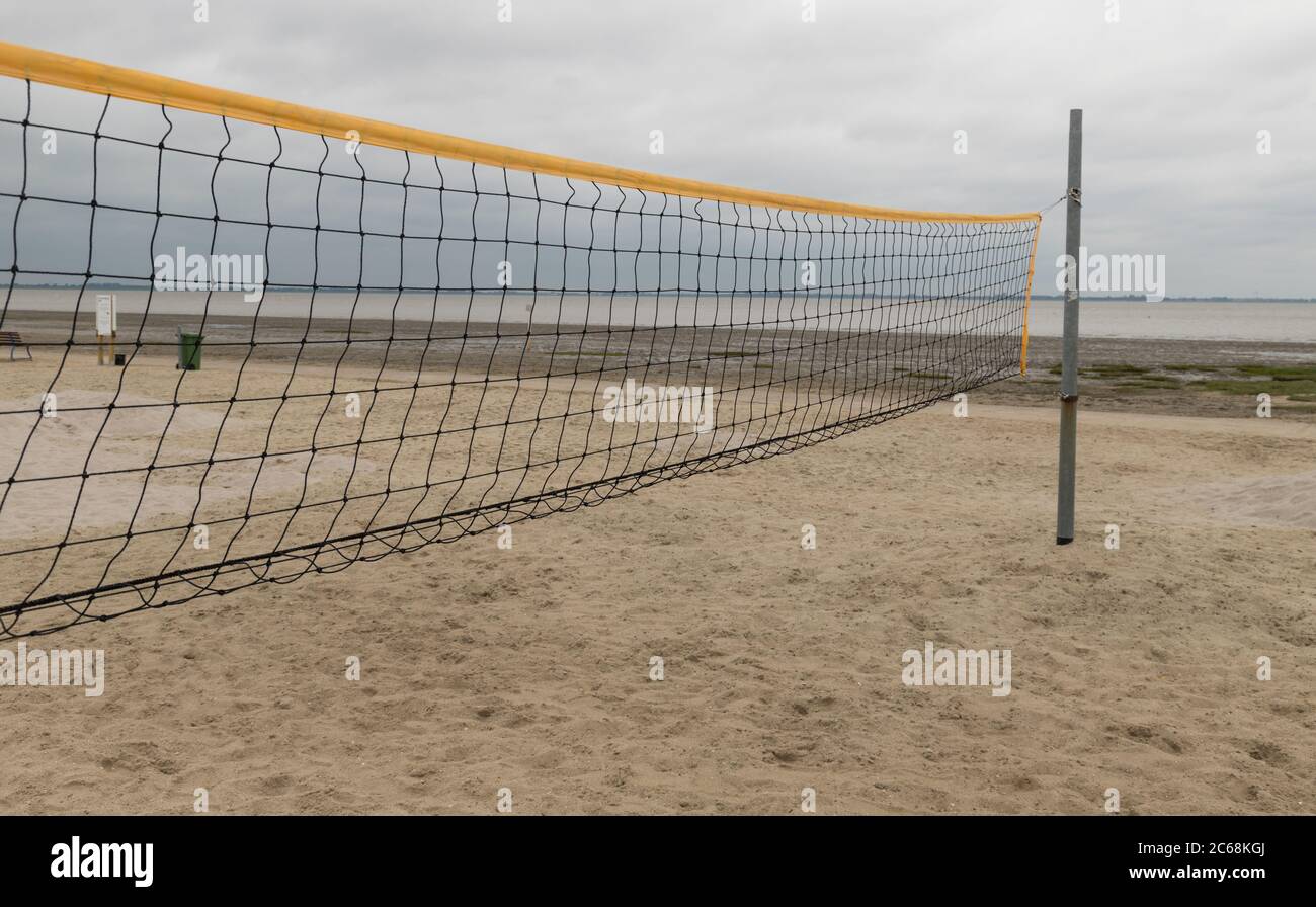 black volleyball net on a beach with north sea in the background Stock ...