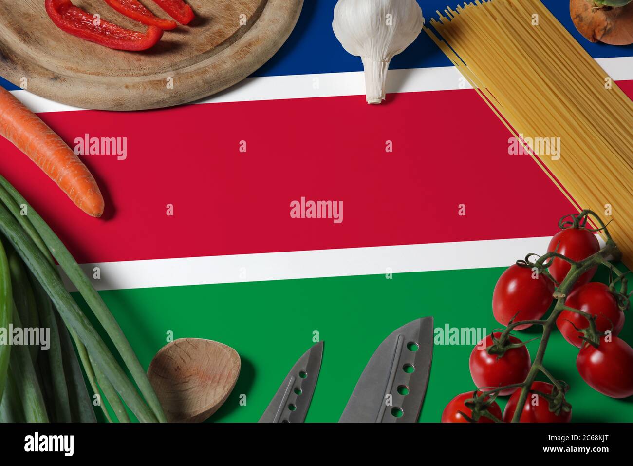 Namibia flag on fresh vegetables and knife concept wooden table ...