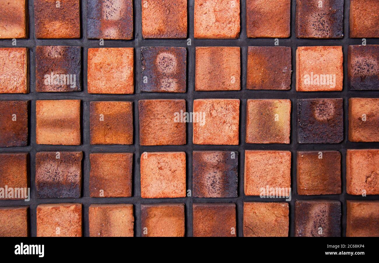Square layout of bricks side by side - on a wall. The front of the ...