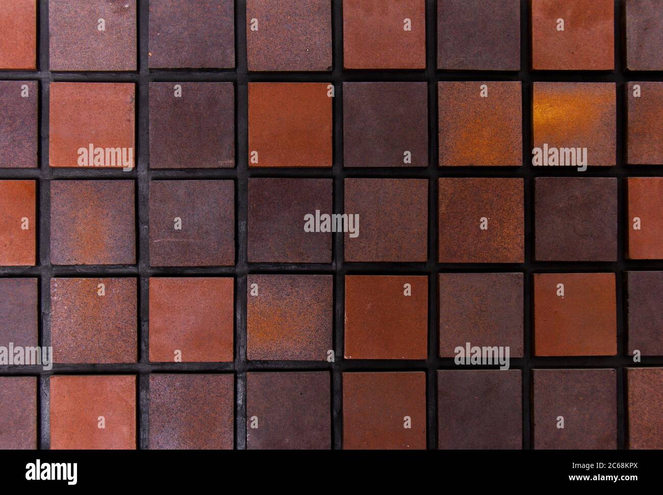 Square layout of bricks side by side - on a wall. The front of the ...