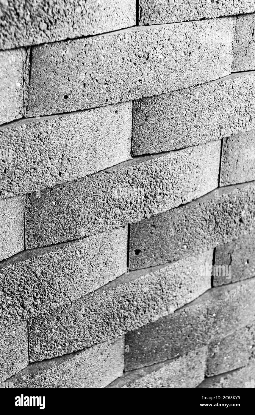 Irregular brick arrangement. On the wall. In black and white Stock ...
