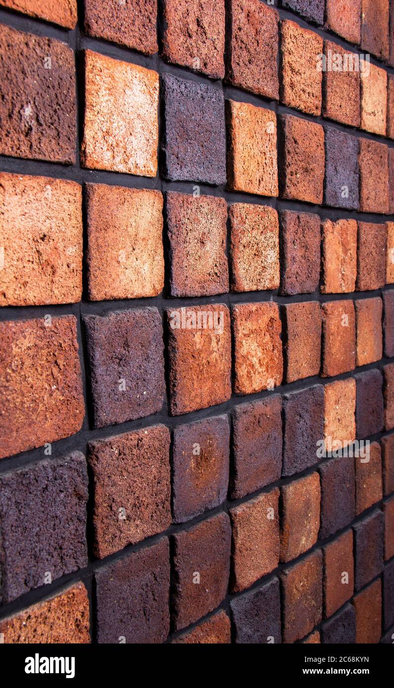 Square layout of bricks side by side - on a wall. The front of the ...