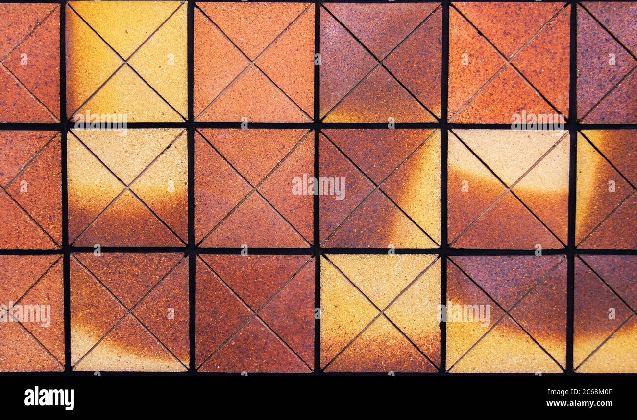 Square layout of bricks side by side - on a wall. The front of the ...