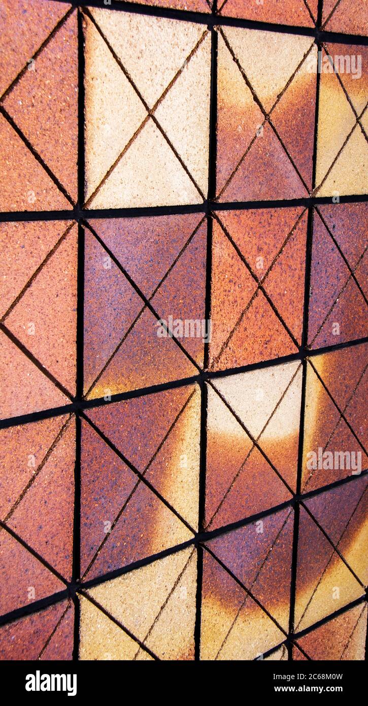 Square layout of bricks side by side - on a wall. The front of the ...