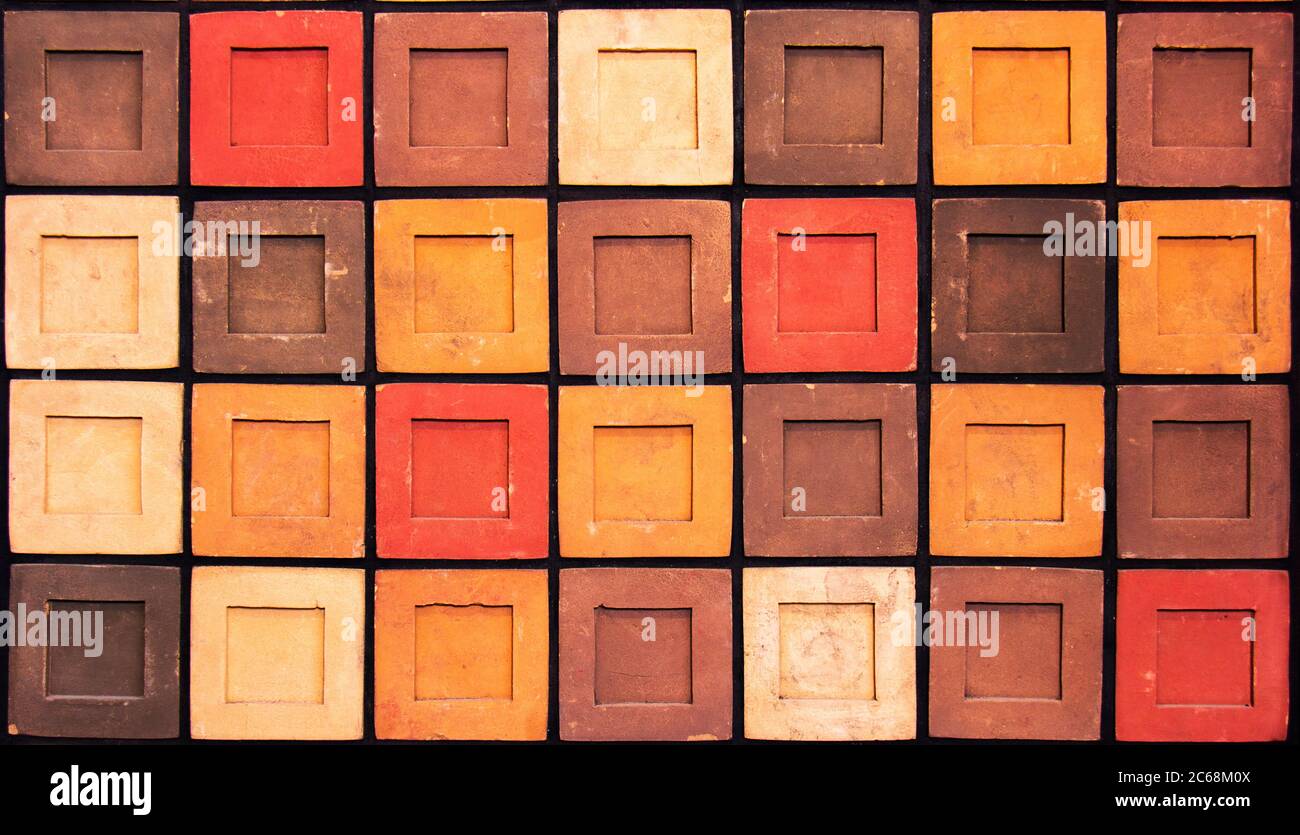 Square layout of bricks side by side - on a wall. The front of the ...