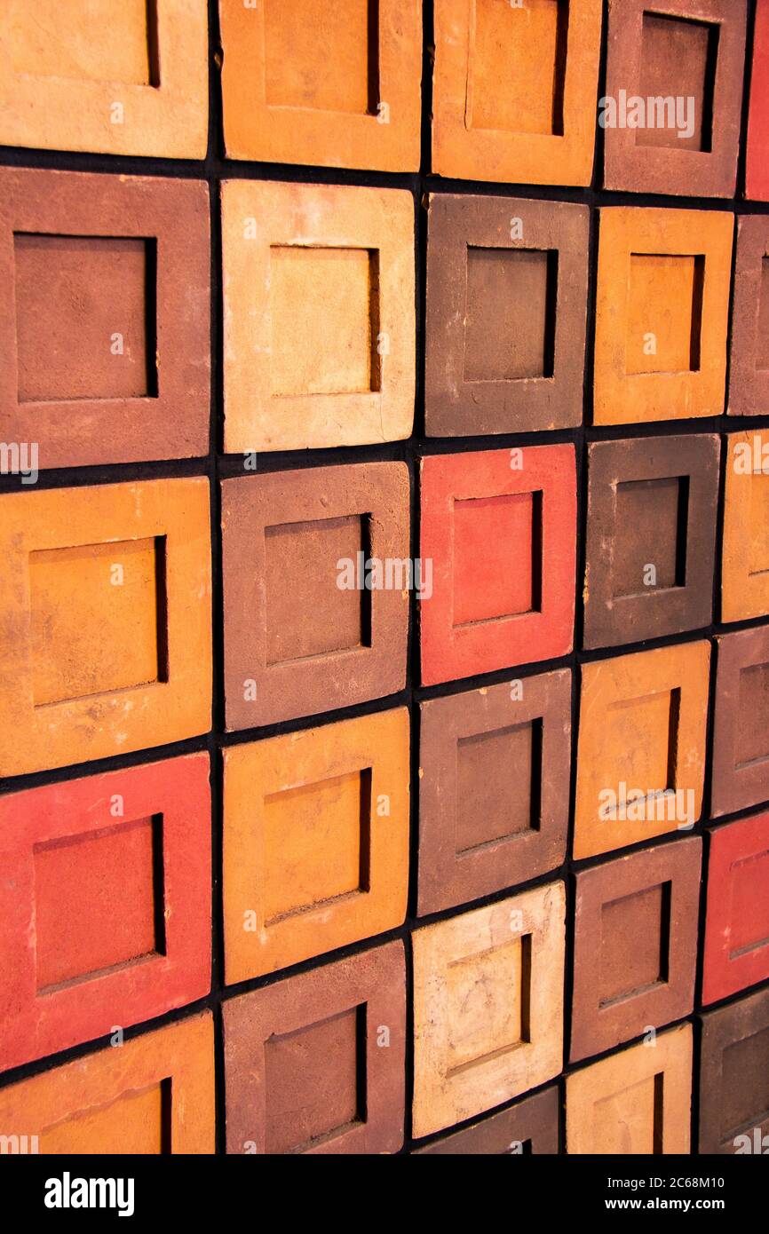 Square layout of bricks side by side - on a wall. The front of the ...
