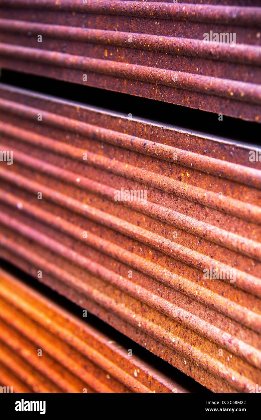 View from a side angle of bricks side by side - on a wall. The front of ...