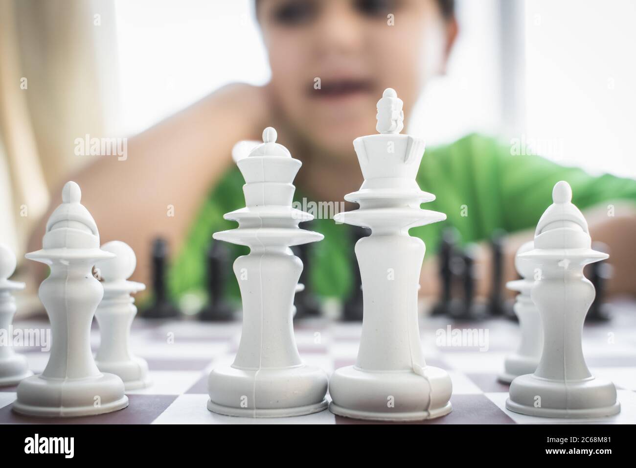 Little boy playing chess.Smart kid.Little genius Child. Intelligent gam ...