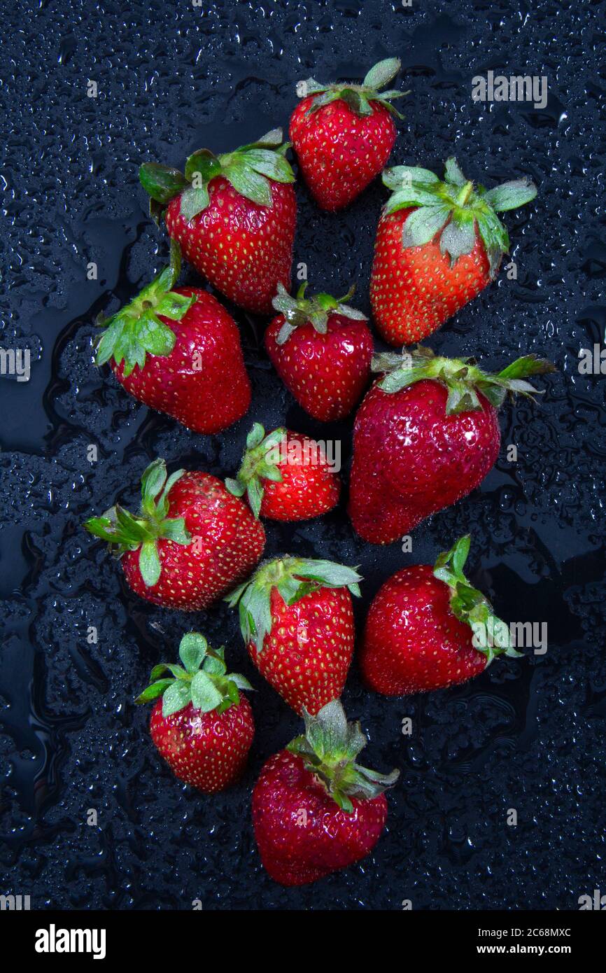 Strawberries are ripe and some of the strawberry slices can be seen ...