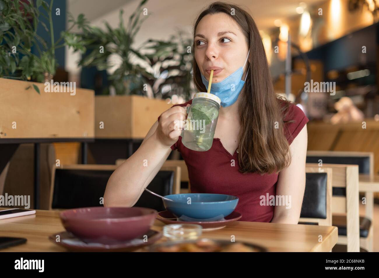 New normal concept of woman with mask eating in restaurant Stock Photo ...