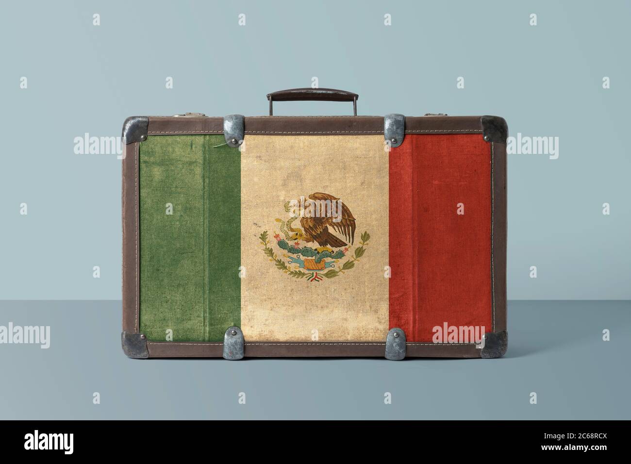 Mexico flag on old vintage leather suitcase with national concept ...