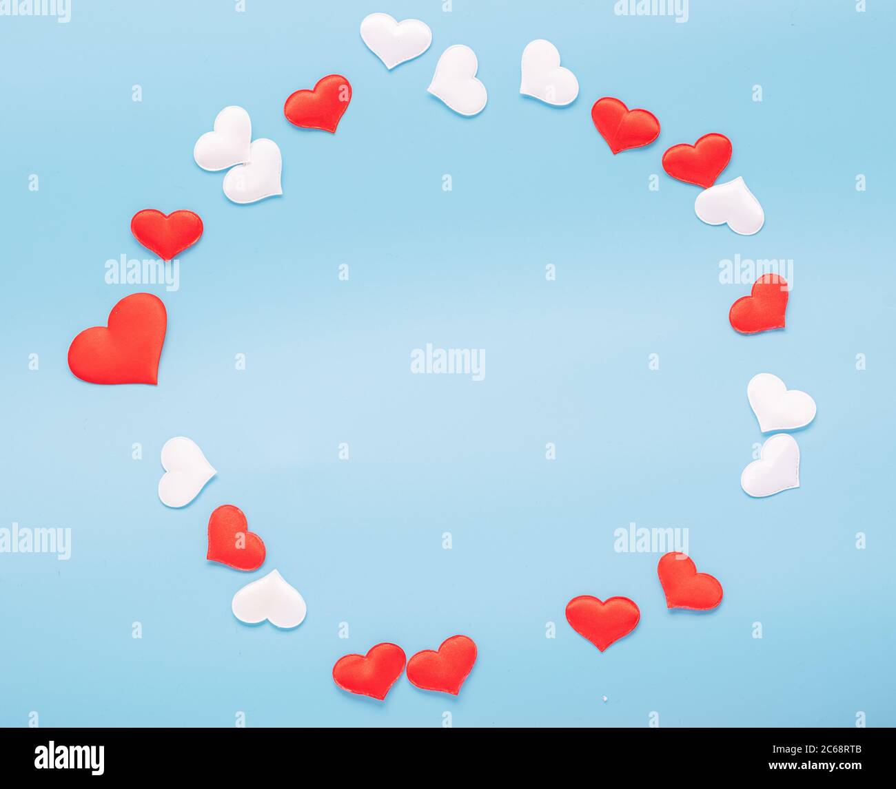 Red hearts symbol of love lined with a square frame on blue background ...