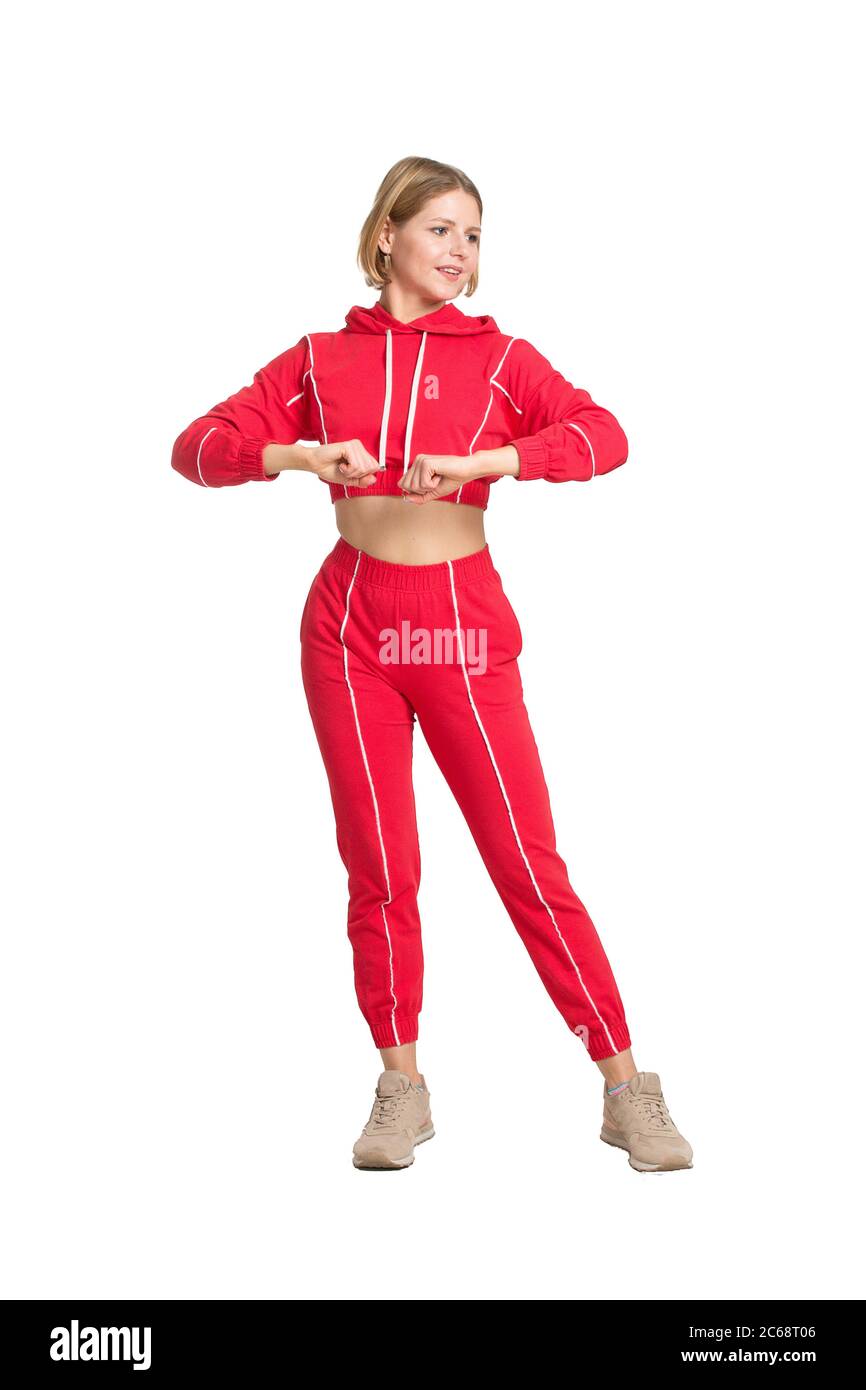 Young Fitness woman in red training dress. Isolate on white background ...