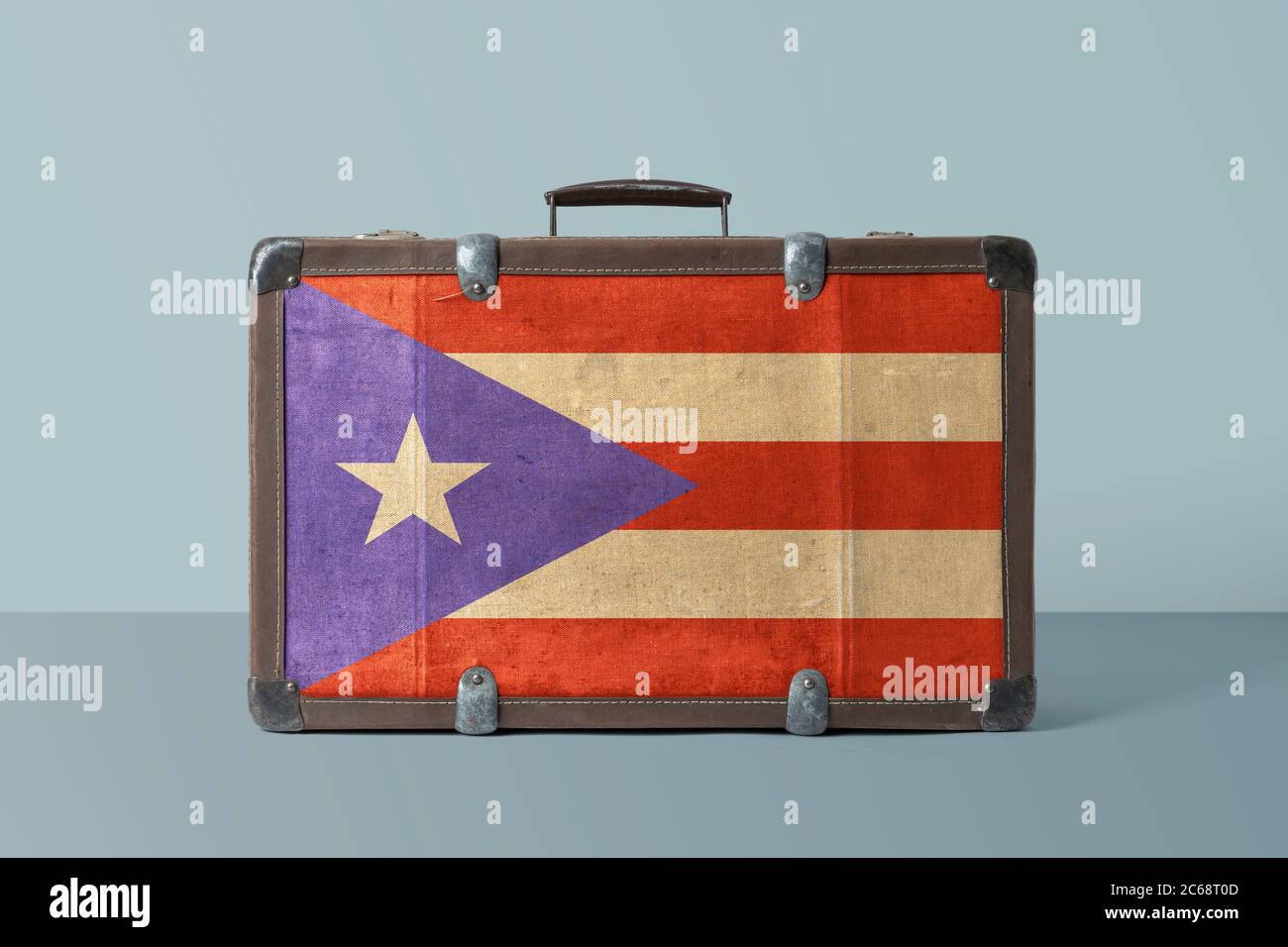 Puerto Rico flag on old vintage leather suitcase with national concept ...