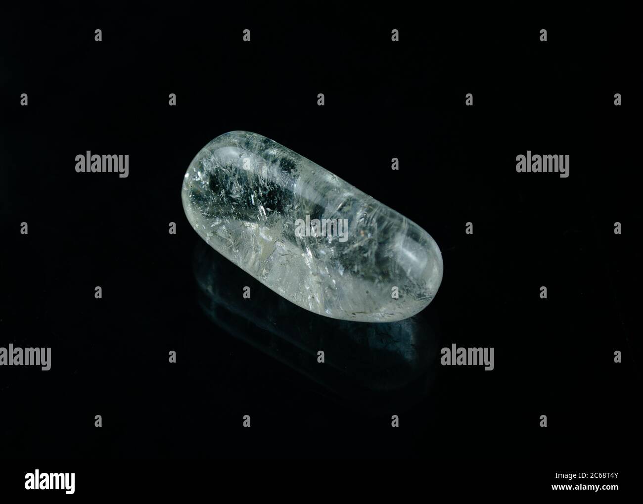 An almost water-clear rock crystal with beautiful inclusions Stock ...