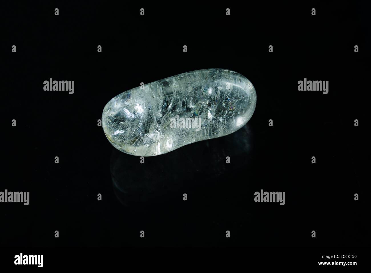 An almost water-clear rock crystal with beautiful inclusions Stock ...