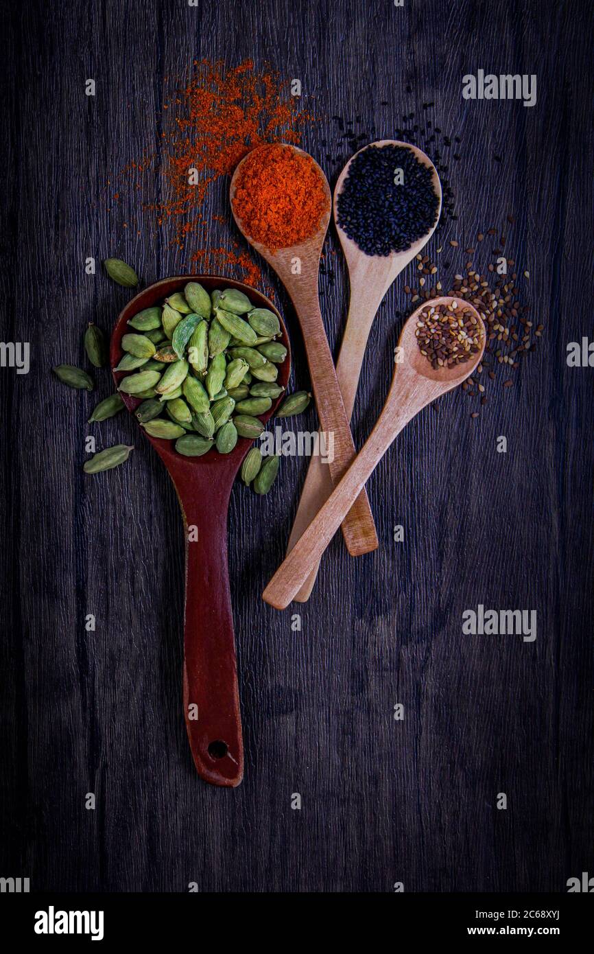 Different types of spices in small dishes with different colors ...