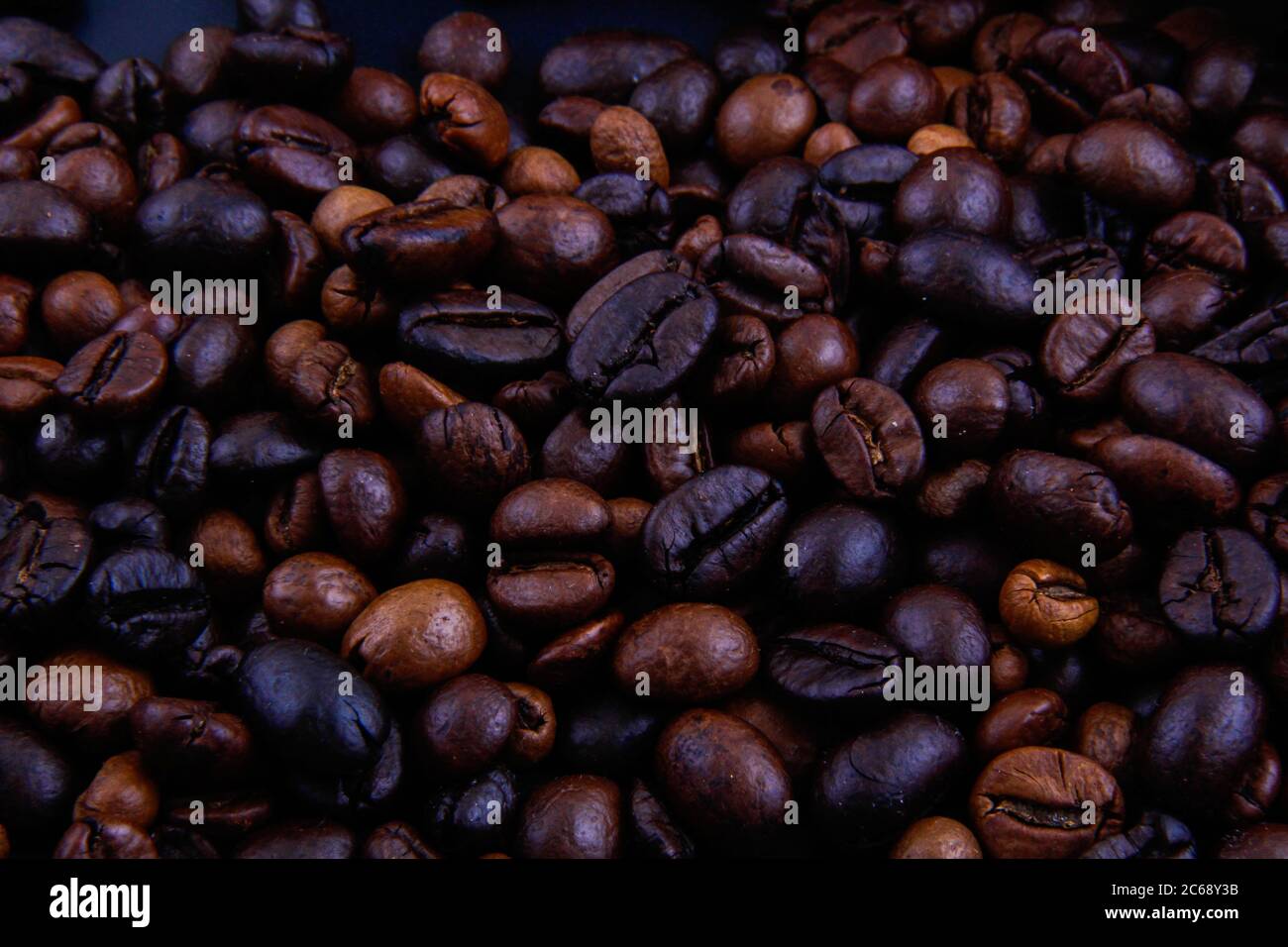 Coffee beans and coffee powder in the container and outside together ...