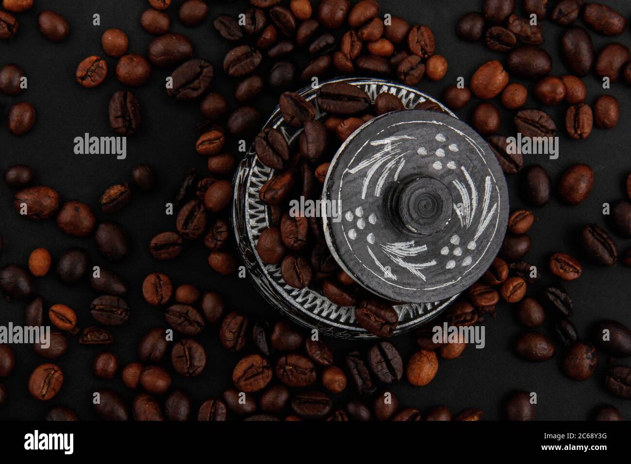 Coffee beans and coffee powder in the container and outside together ...