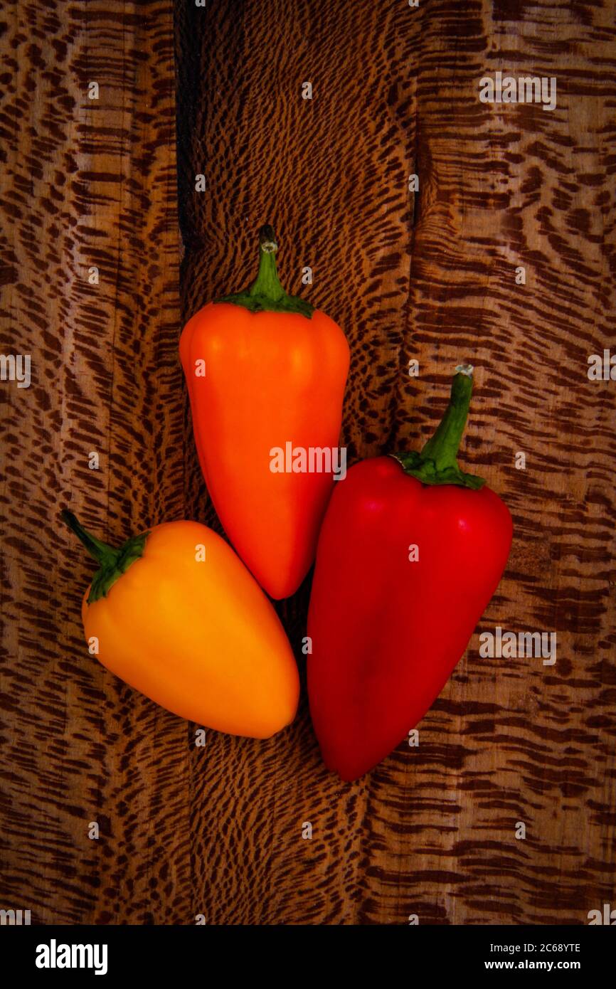 Red and colored peppers in small bowls Stock Photo - Alamy
