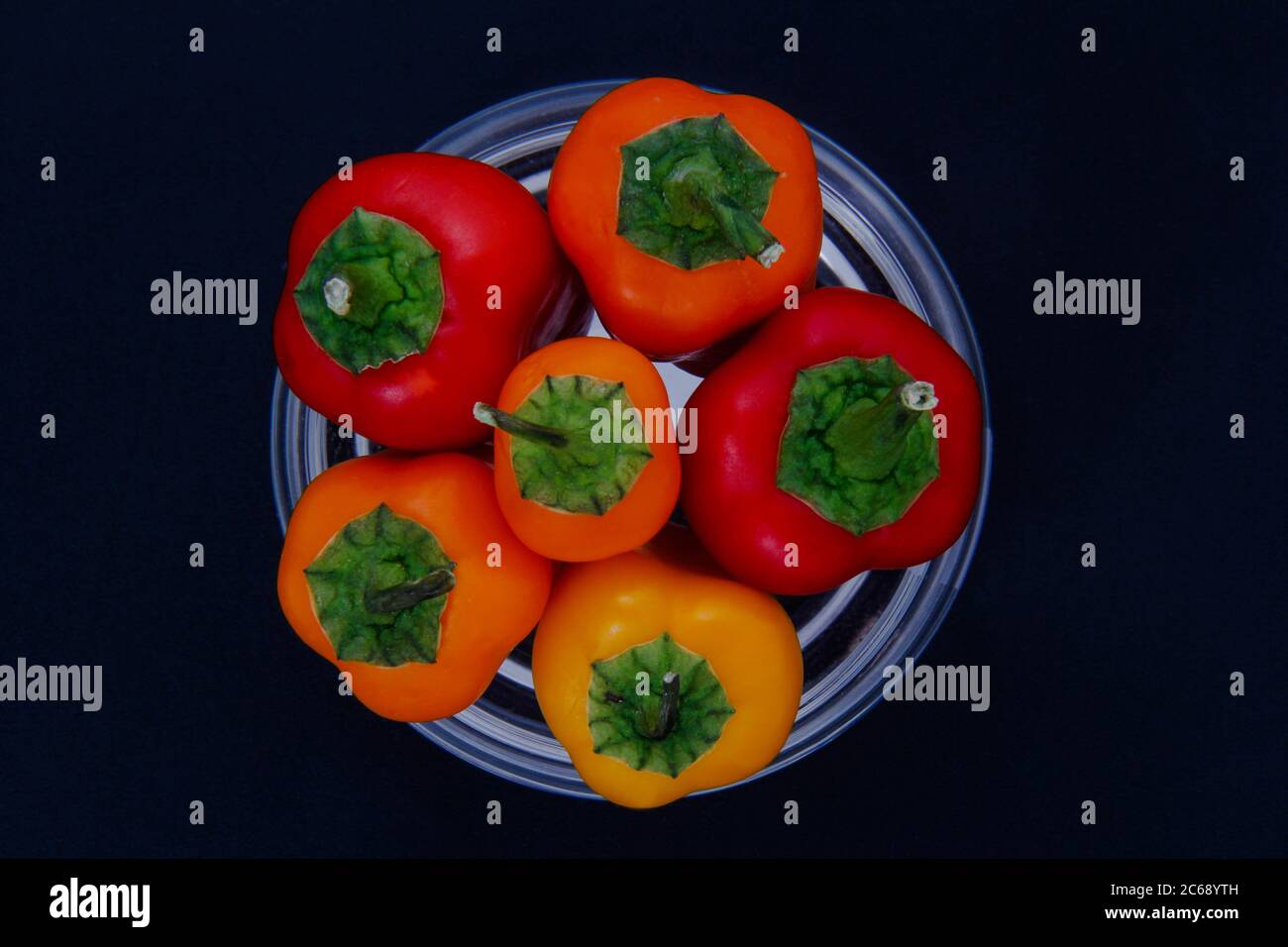 Red and colored peppers in small bowls Stock Photo - Alamy