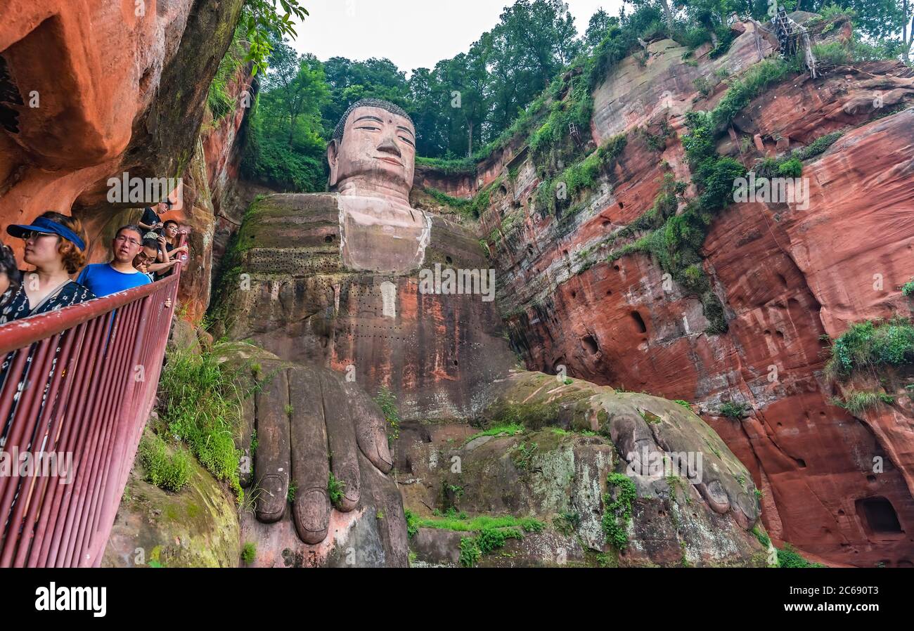 Leshan, China - July 2019 : Crowds of tourists walking down the plank ...