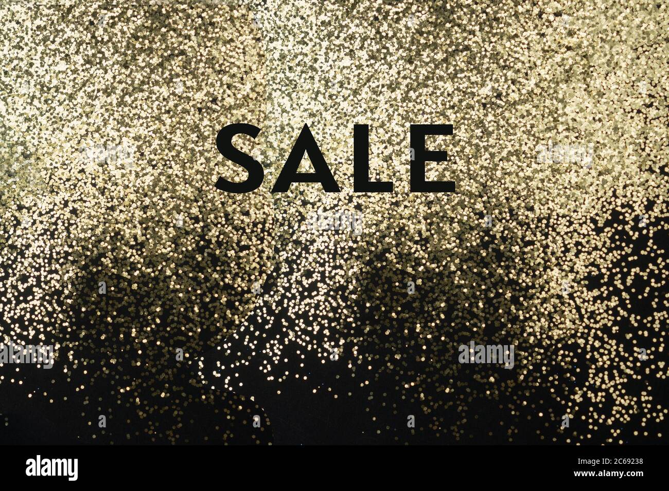 Sale on golden shiny background of sparkles. Clearance sale concept ...