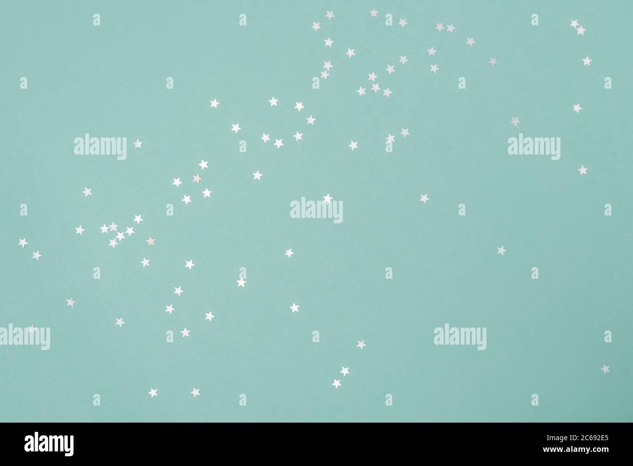 White stars on mint backdrop. Festive concept. Flat lay style Stock ...