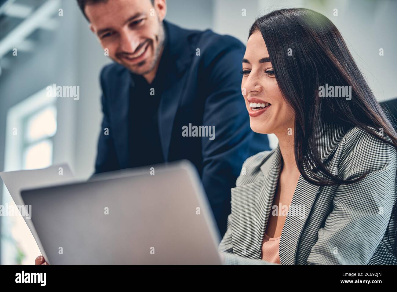 Project team making conversation at meeting room at office Stock Photo ...