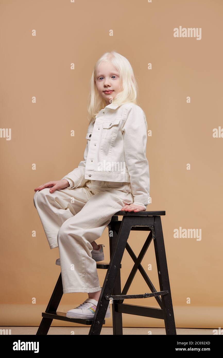 portrait of little fashion model, kid girl with abnormal deviations ...