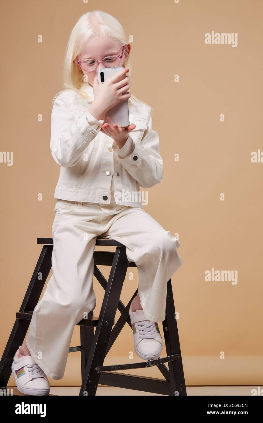 portrait of little fashion model, kid girl with abnormal deviations ...