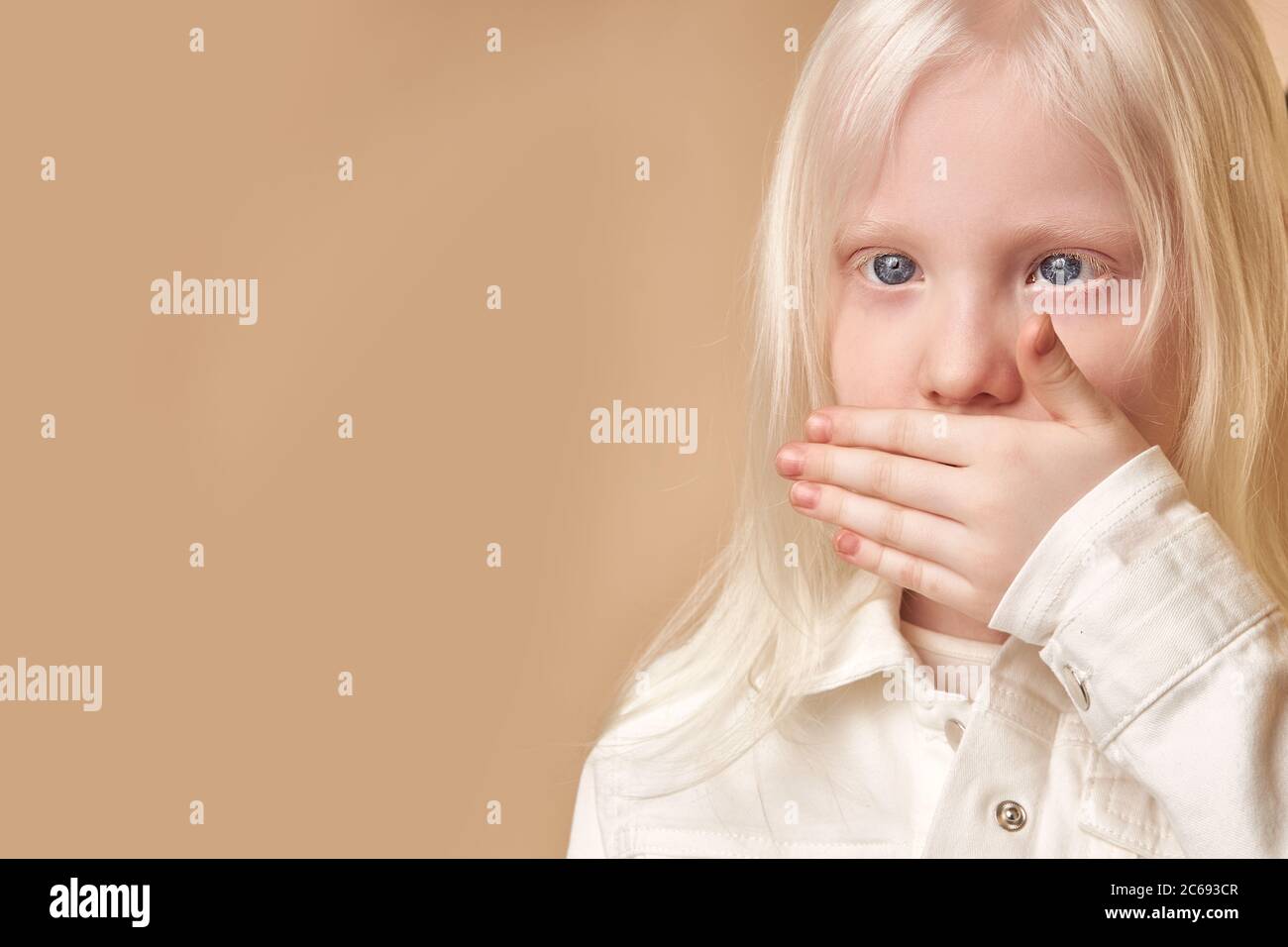 strange little caucasian girl with unusual appearance, she has pale ...