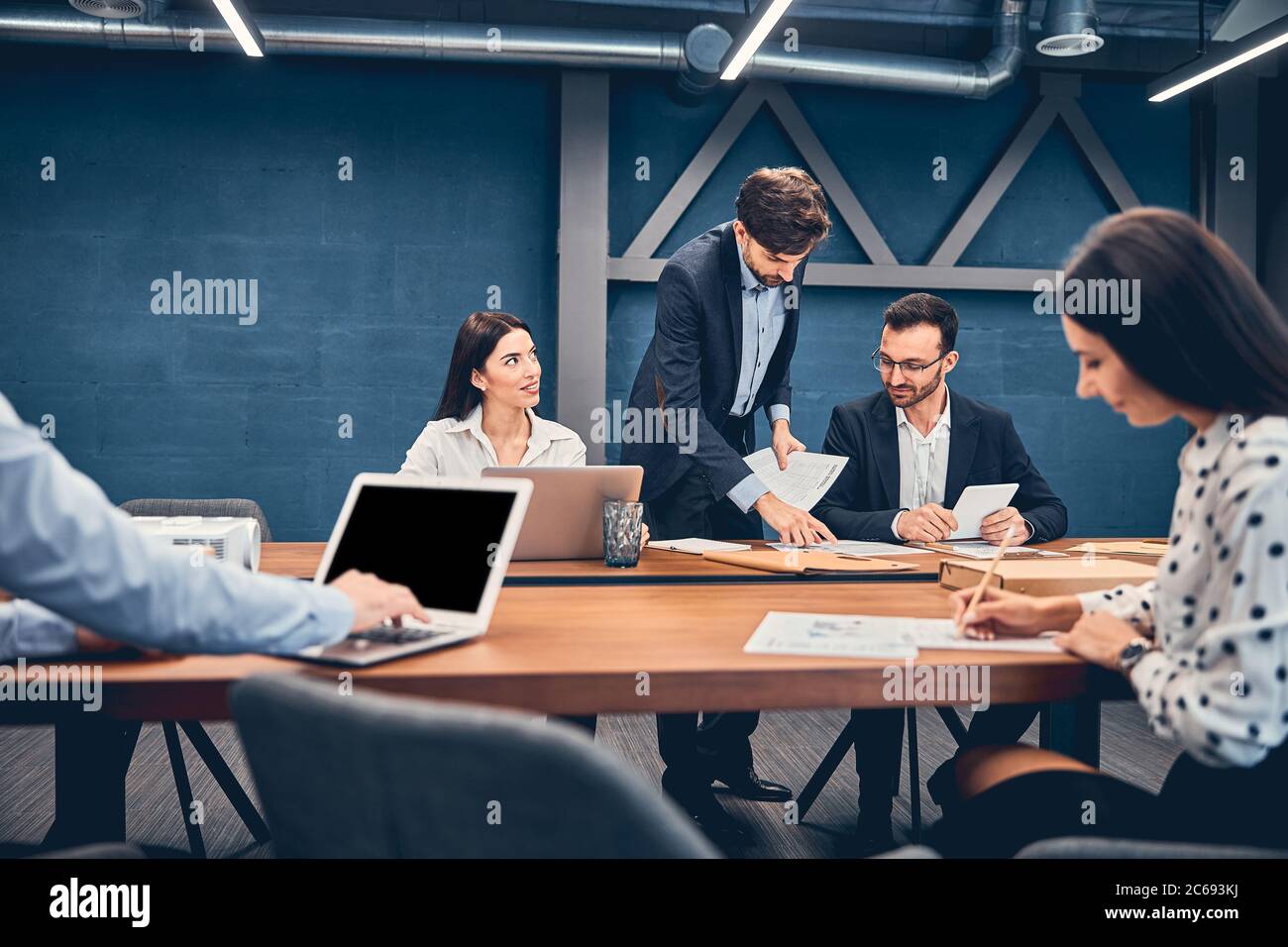 Full concentration at work of friendly team Stock Photo - Alamy