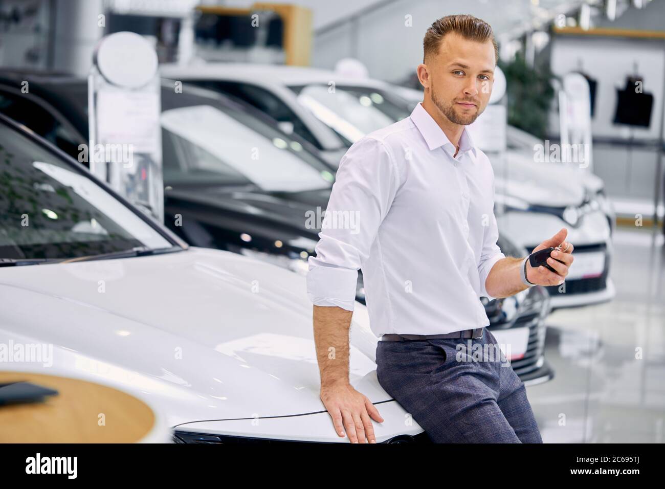 new happy car owner in dealership. man got keys of car, the perfect ...
