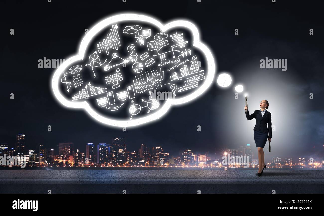 Woman throwing light on her ideas Stock Photo - Alamy