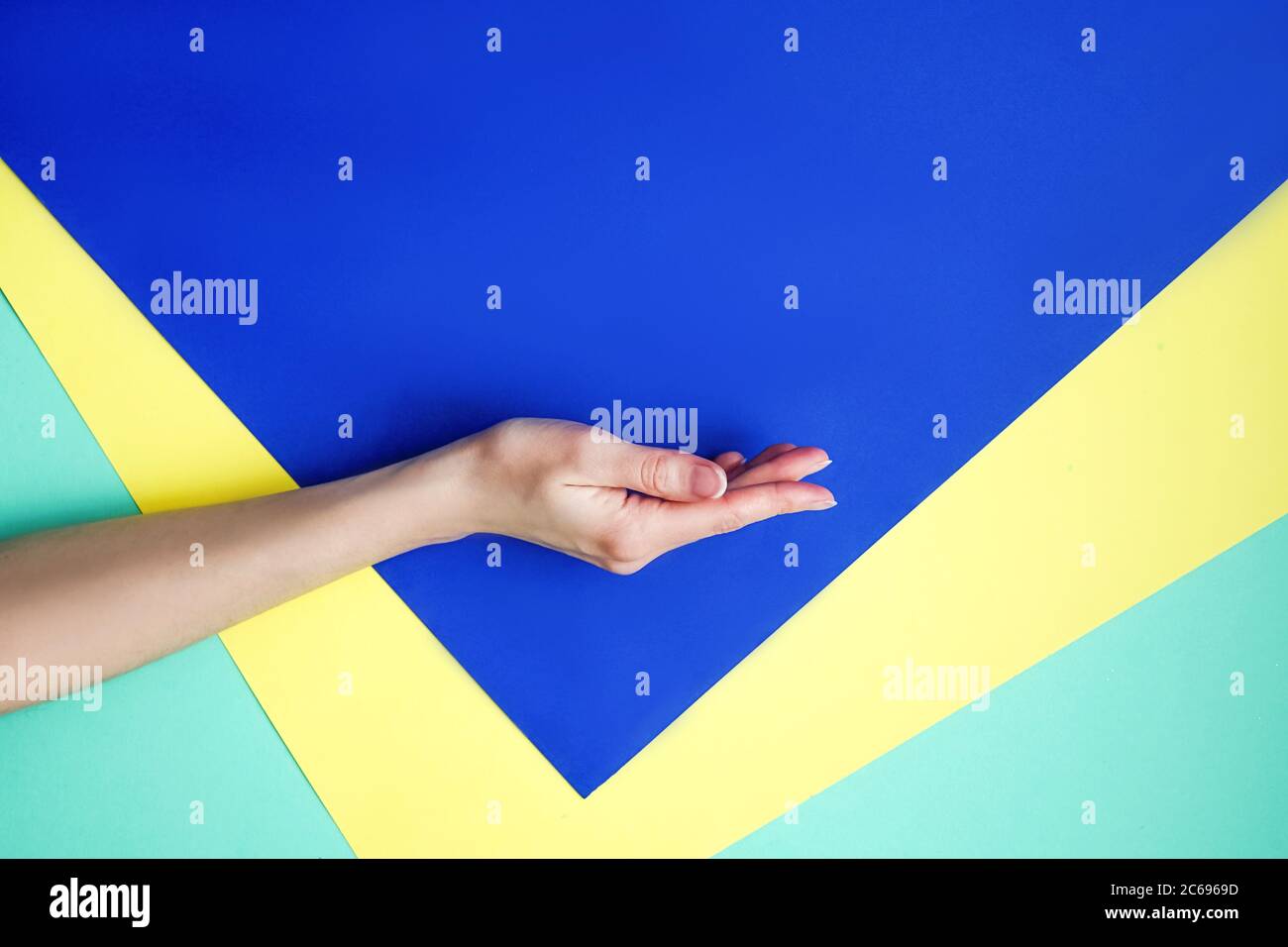 Woman's hand on colorful background. Layout for advertisement Stock ...