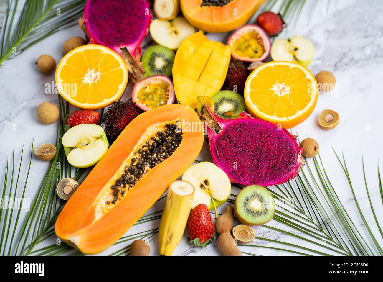 Summer composition from different sliced exotic fruits and tropical ...