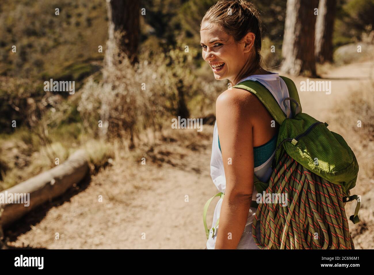 Back view young woman walking on hiking trail hi-res stock photography ...