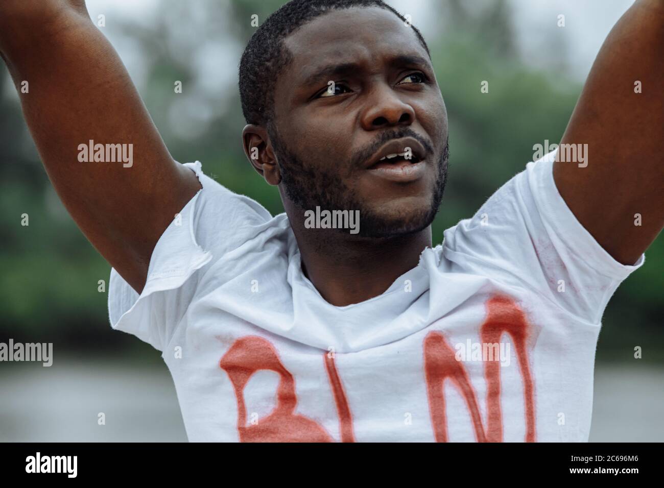 black man protest against injustice, blm concept. young guy in t-shirt ...